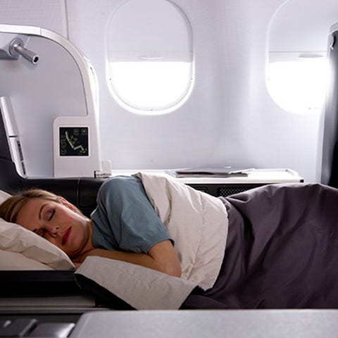 Woman sleeping in business class